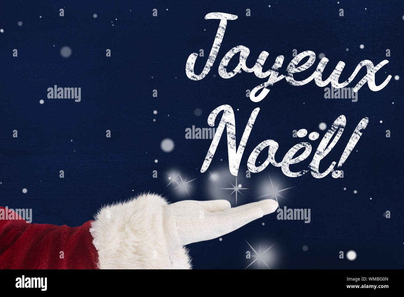 Santa Claus shows open hand against navy blue Stock Photo - Alamy