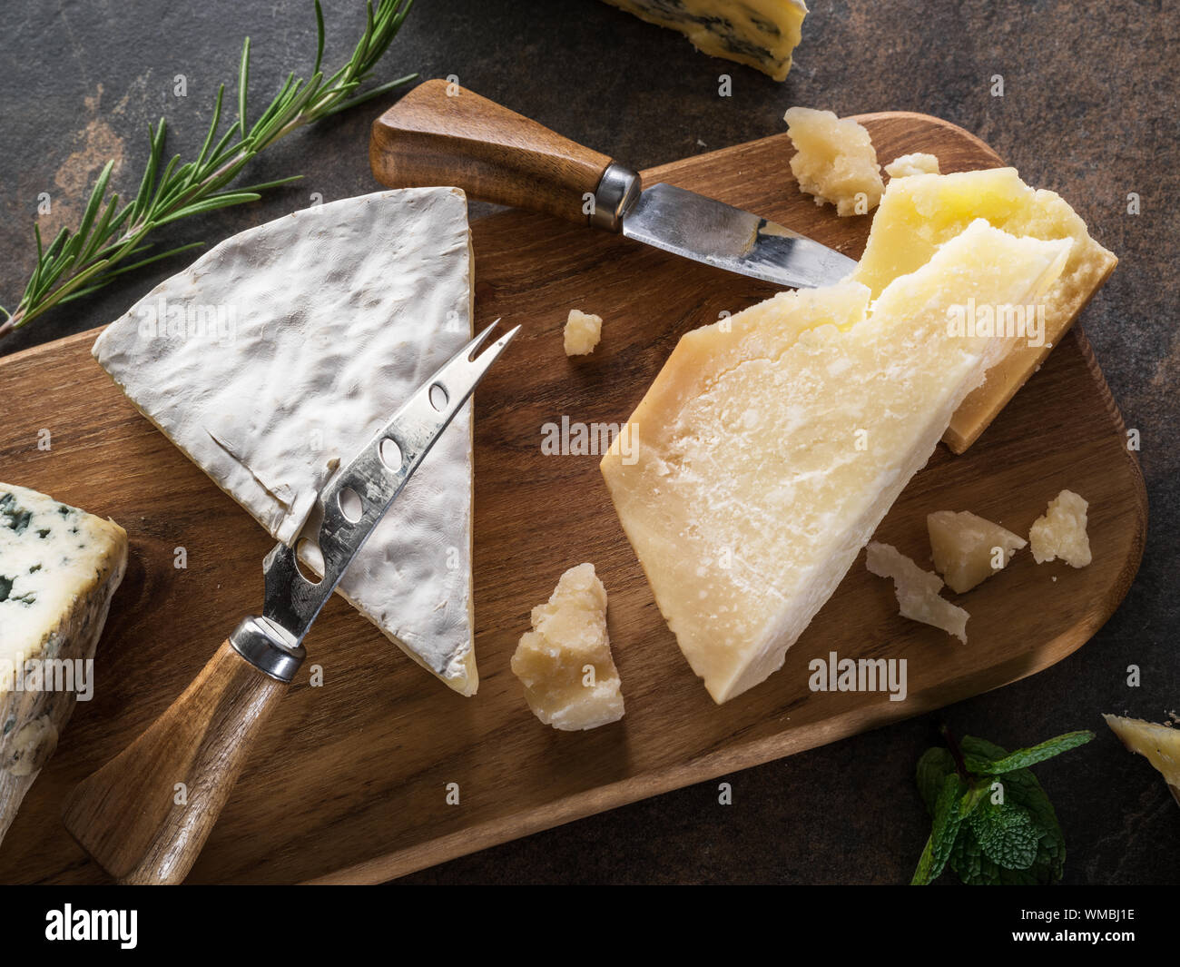 Cheese platter with Parmesan and blue cheese on stone background. Top ...