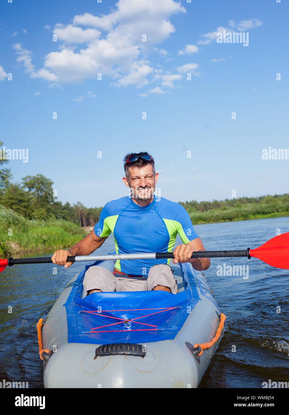 Summer vacation - Young man kayaking on the river Stock Photo - Alamy