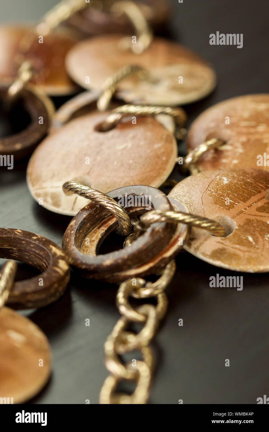 Scratched and tarnished old silver jewellery with two flat discs ...