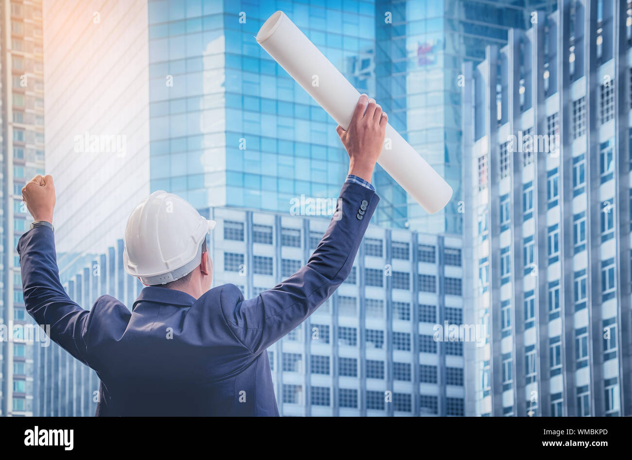 Man holding blueprint hi-res stock photography and images - Alamy