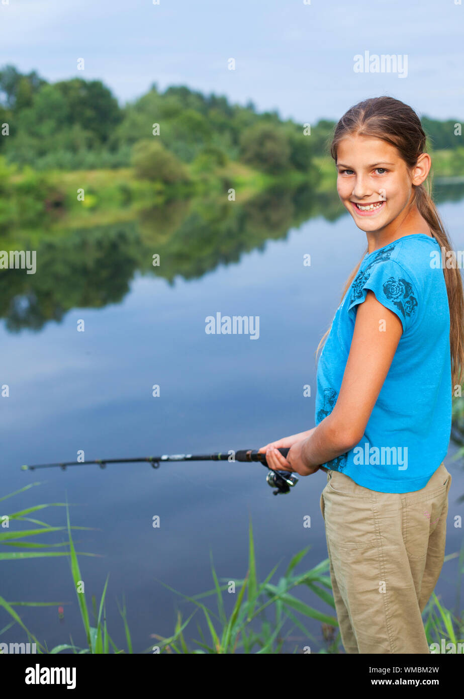 Summer vacation - Photo of cute girl fishing on the river Stock Photo ...