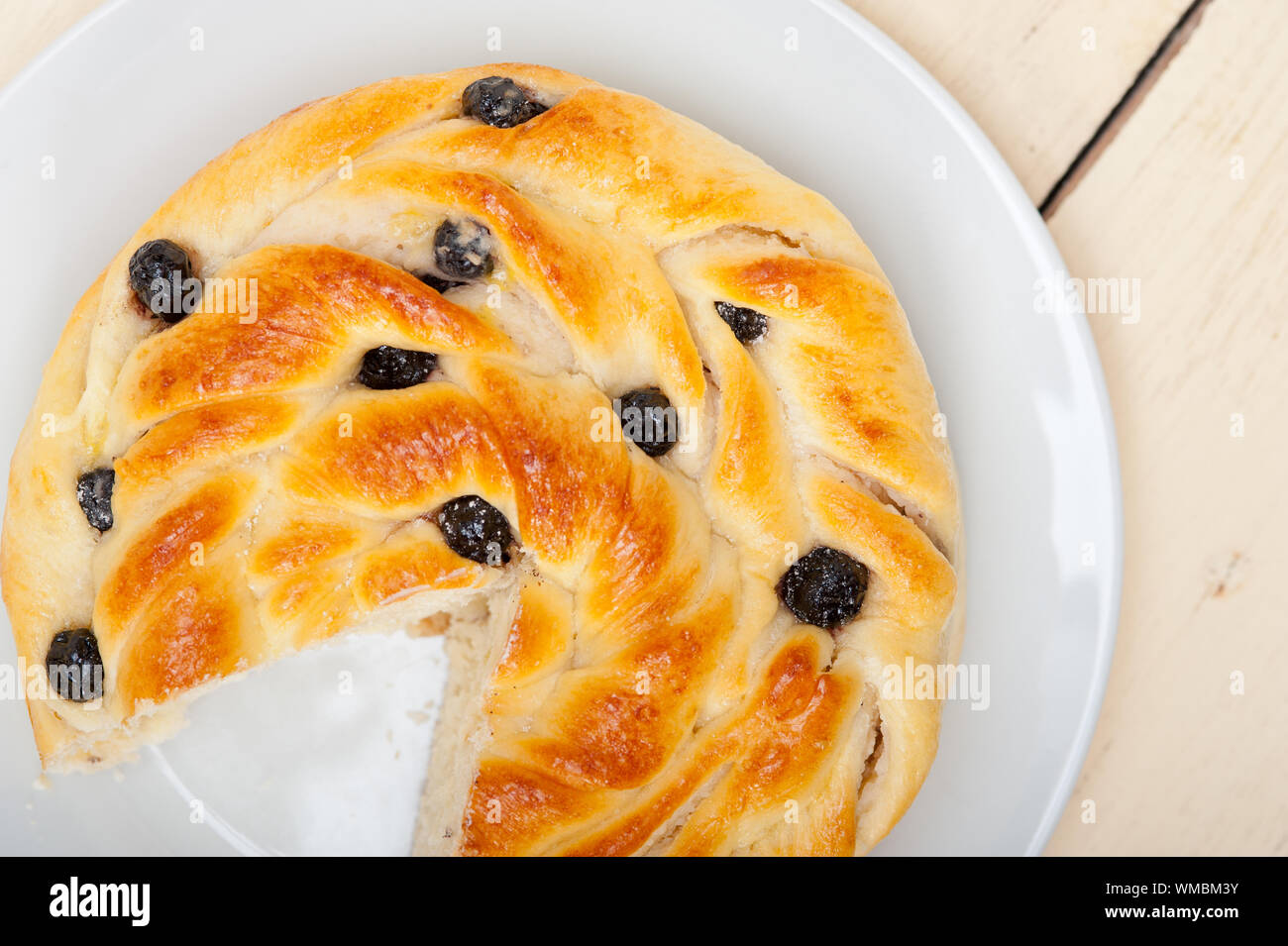 fresh home baked blueberry bread cake dessert over white wood table ...