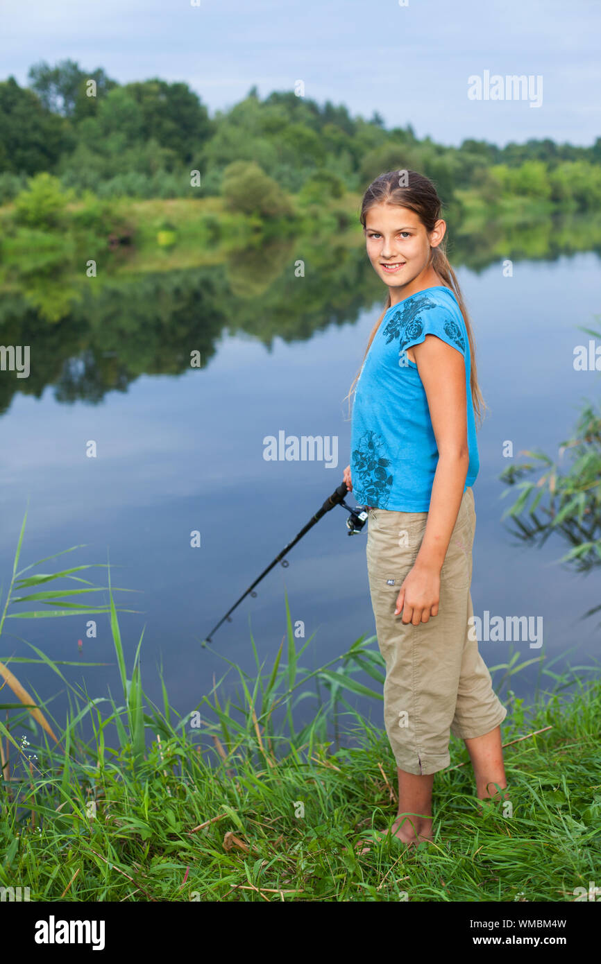 Summer vacation - Photo of cute girl fishing on the river Stock Photo ...
