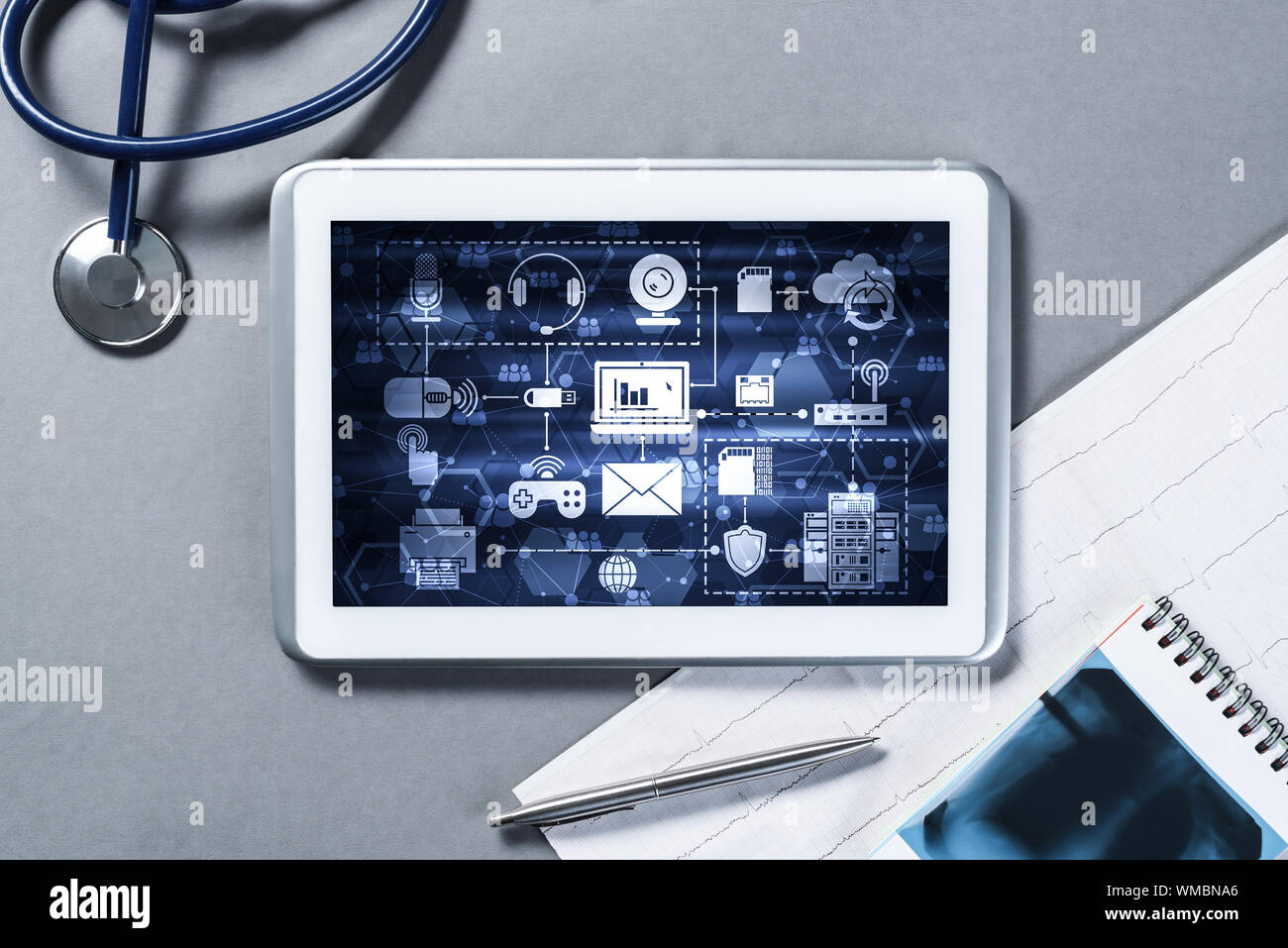 Close up of digital tablet at doctor's desk with stethoscope and other ...