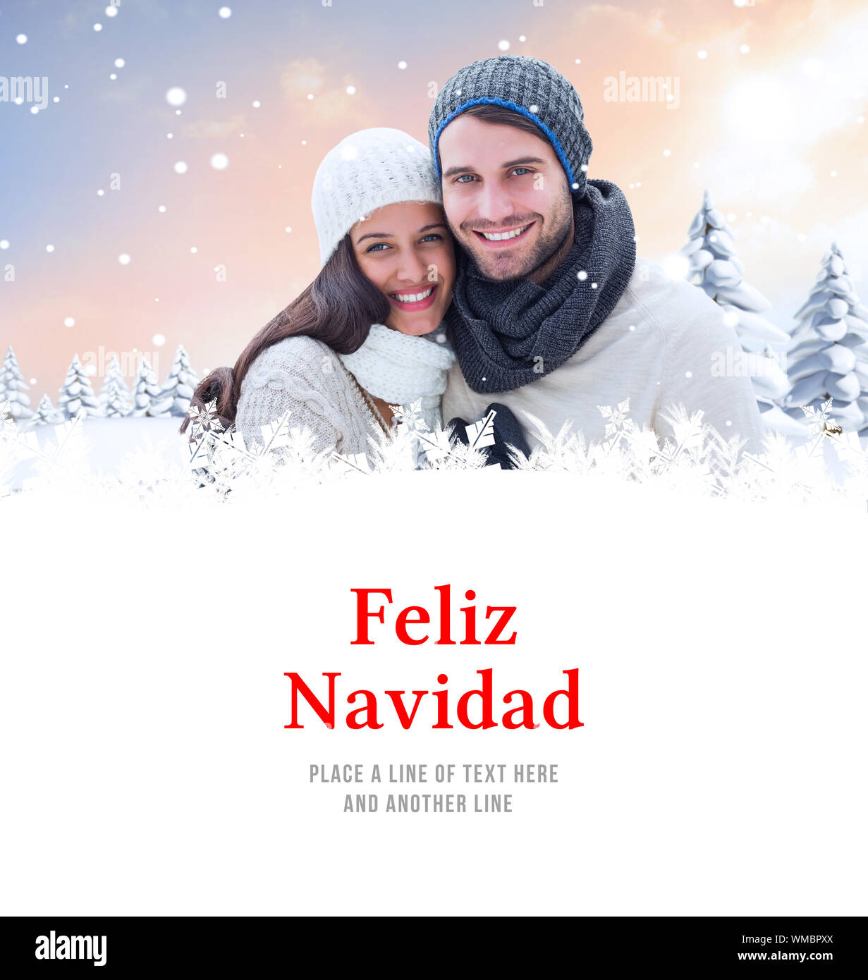 young winter couple against feliz navidad Stock Photo - Alamy