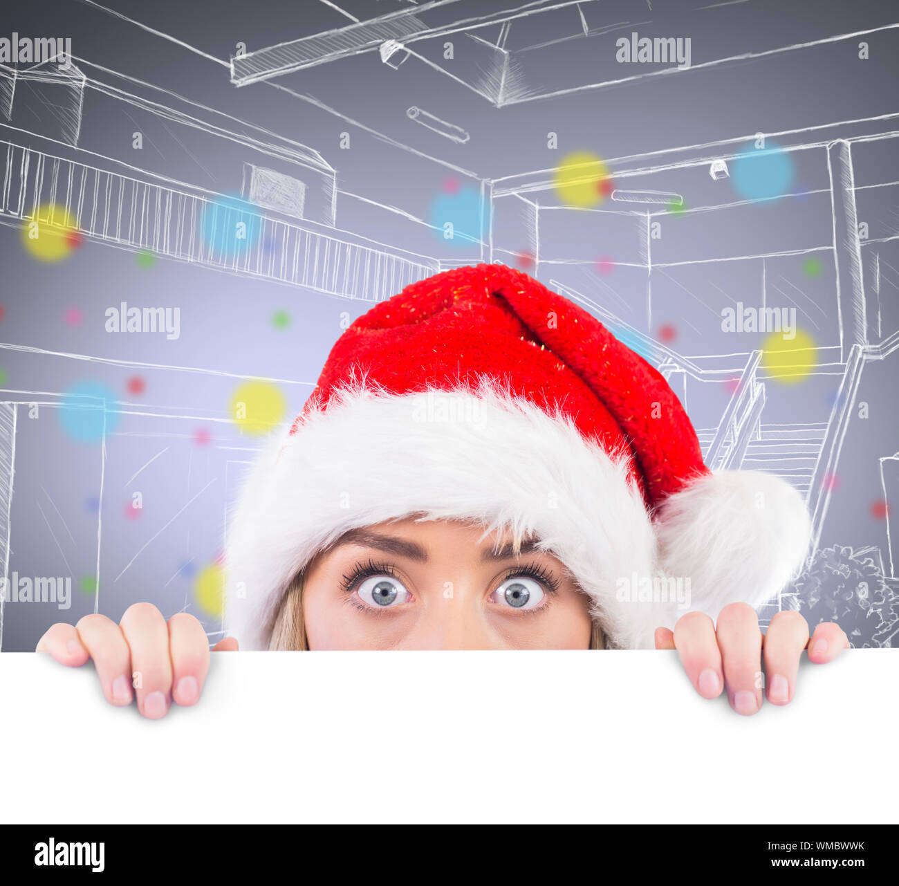 Festive blonde showing large poster against grey vignette Stock Photo ...