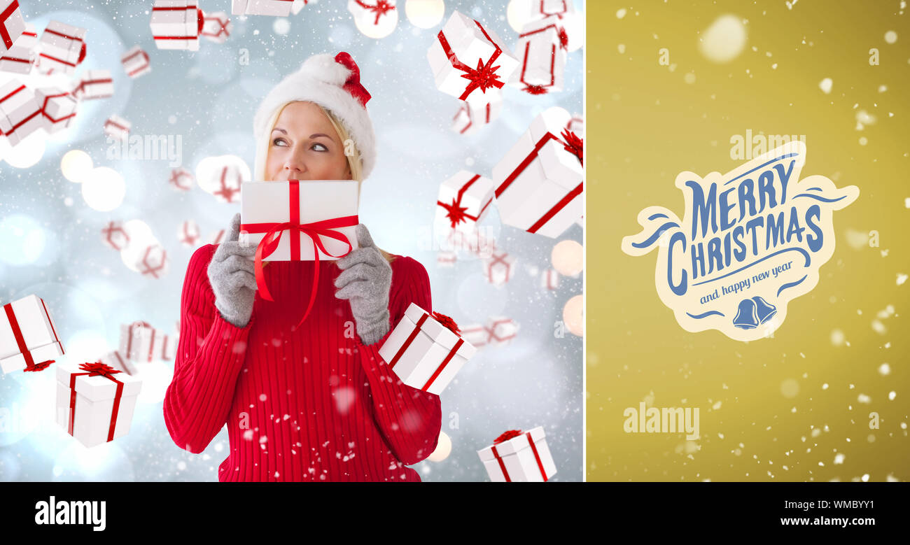 happy festive blonde with gift against yellow vignette Stock Photo - Alamy