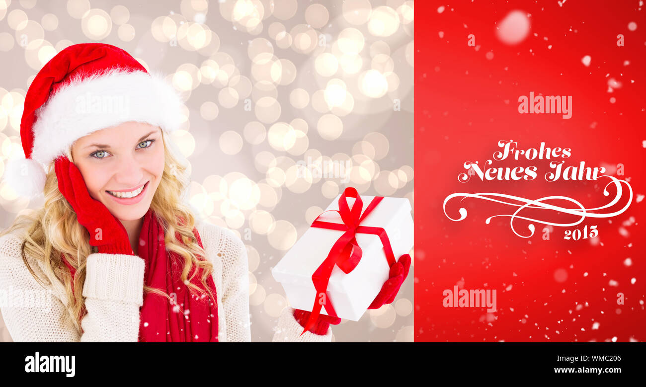 happy festive blonde with gift against red vignette Stock Photo - Alamy