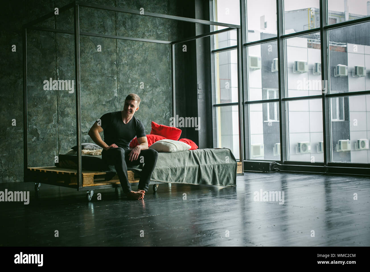 Man sitting bed hi-res stock photography and images - Alamy