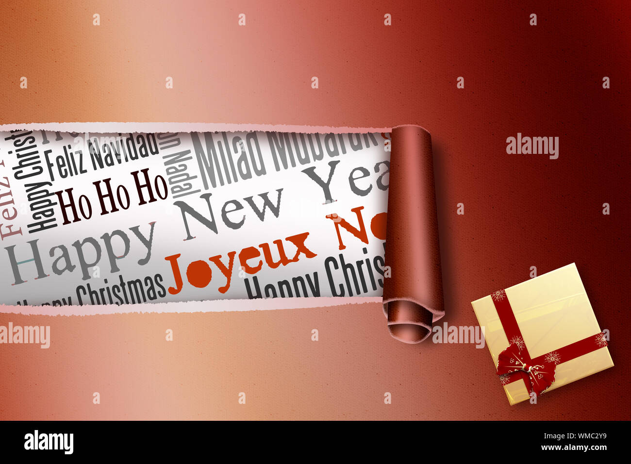 Christmas present with bow against rip in gold paper Stock Photo - Alamy