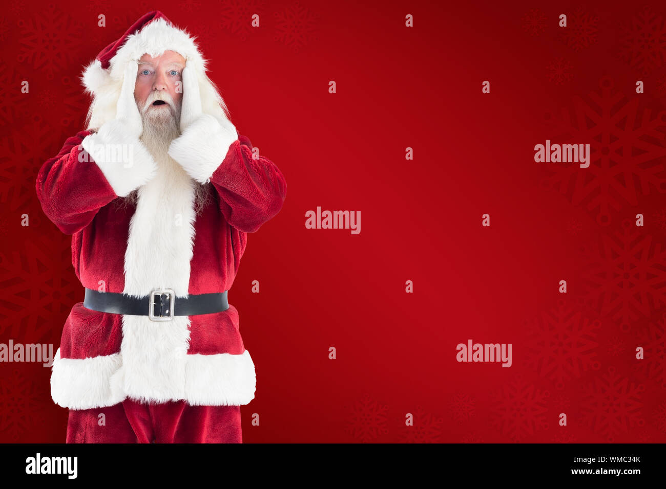 Santa is shocked to camera against red background Stock Photo - Alamy