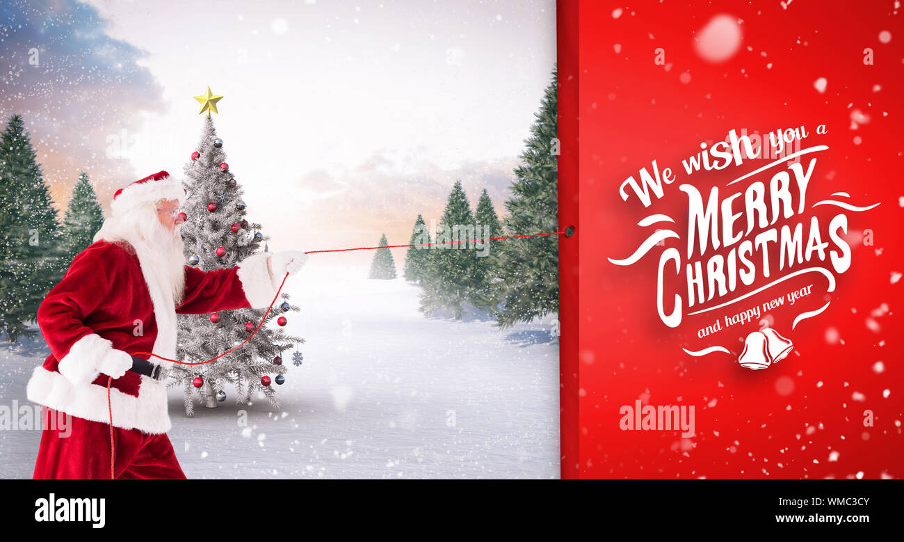 Santa claus pulling a rope against red vignette Stock Photo - Alamy