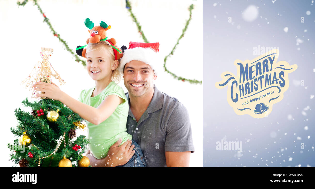 Happy father and daughter decorating together the christmas tree ...