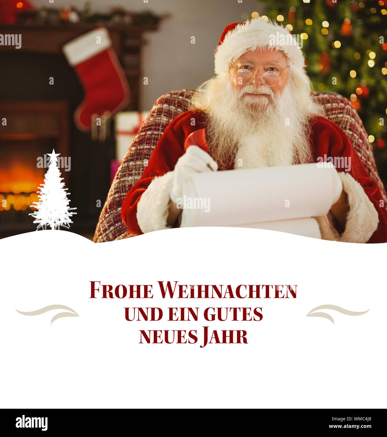 Happy santa writing list with a quill against border Stock Photo - Alamy