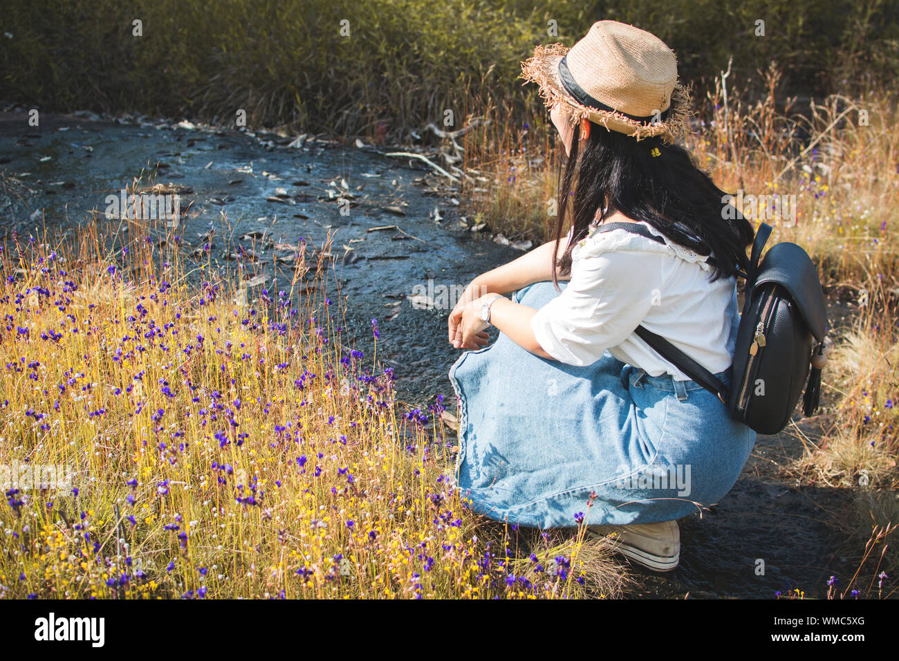 Rear view crouching woman High Resolution Stock Photography and Images ...