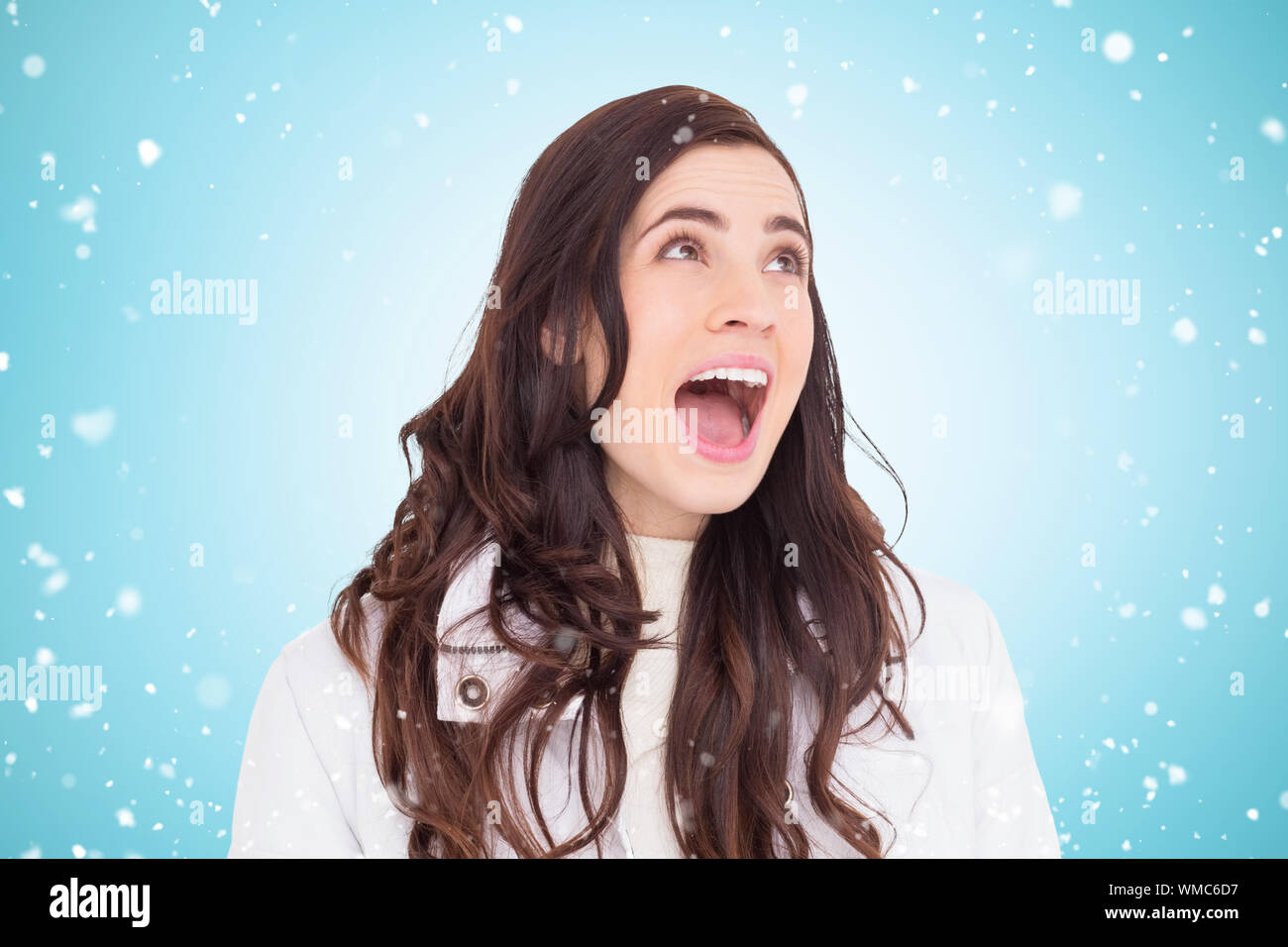 Beauty brown hair in white coat screaming against blue vignette Stock ...