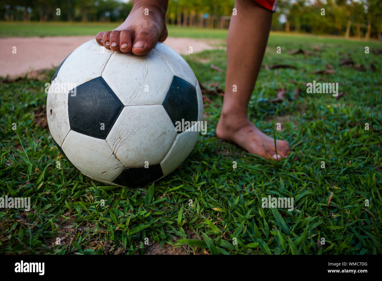 Boys playing soccer barefoot hi-res stock photography and images - Alamy