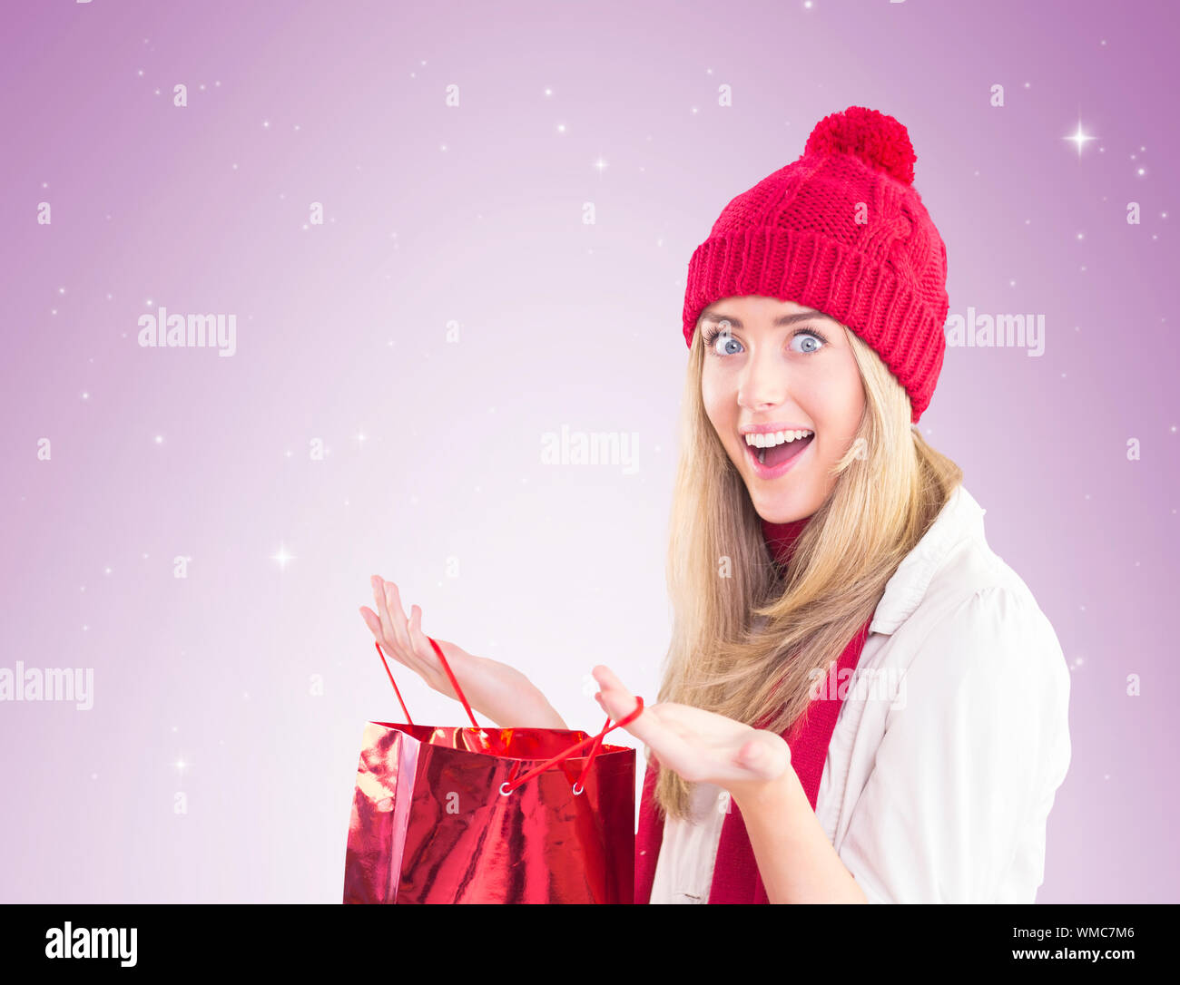 Happy blonde opening gift bag on vignette background Stock Photo - Alamy