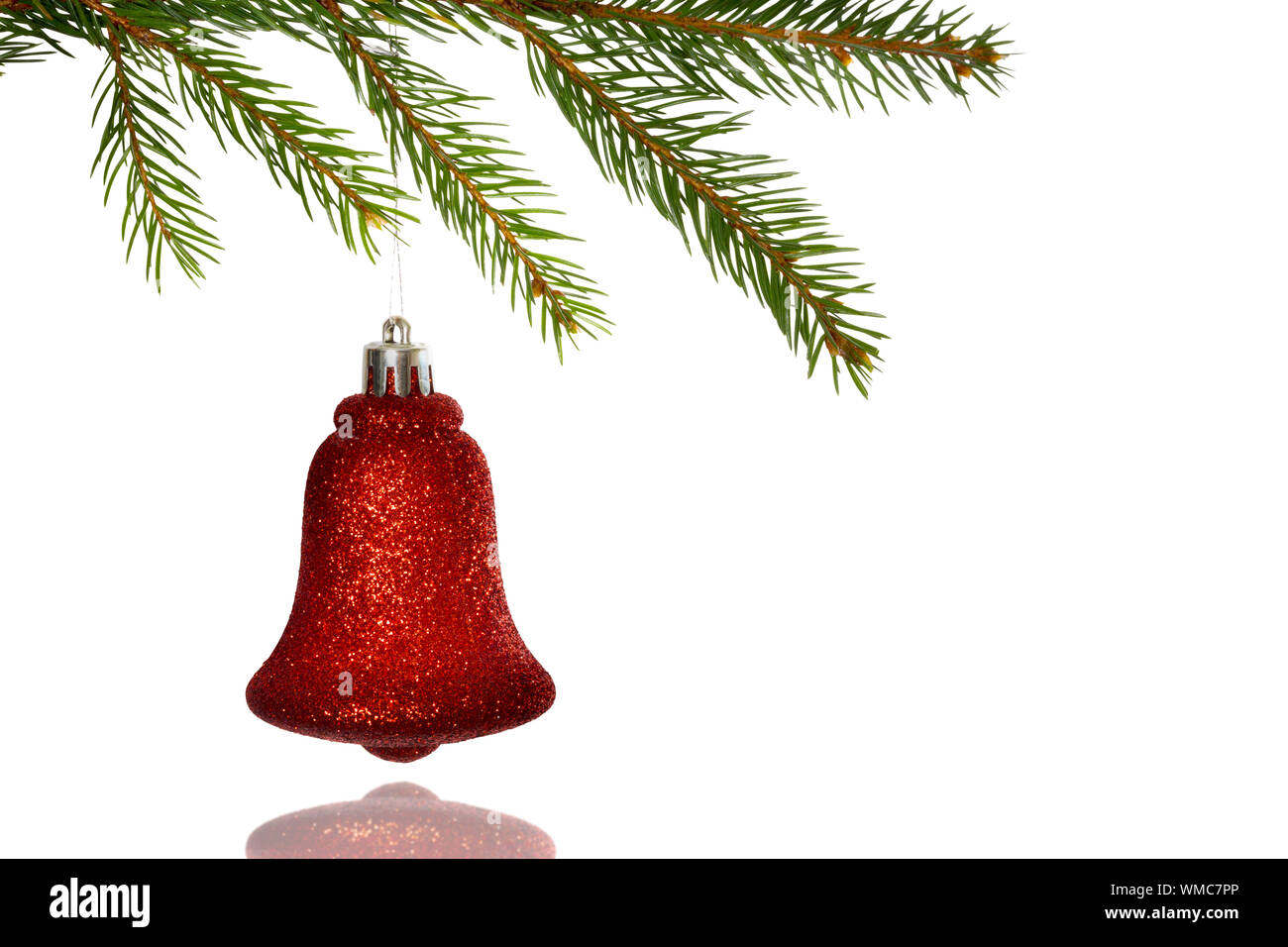 Red christmas decoration hanging from branch on white background Stock ...