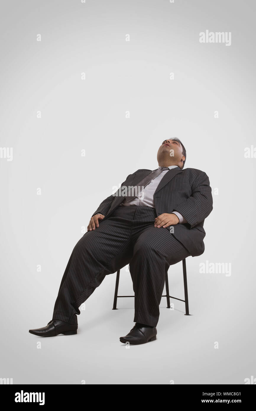 Man sleeping in chair hi-res stock photography and images - Alamy