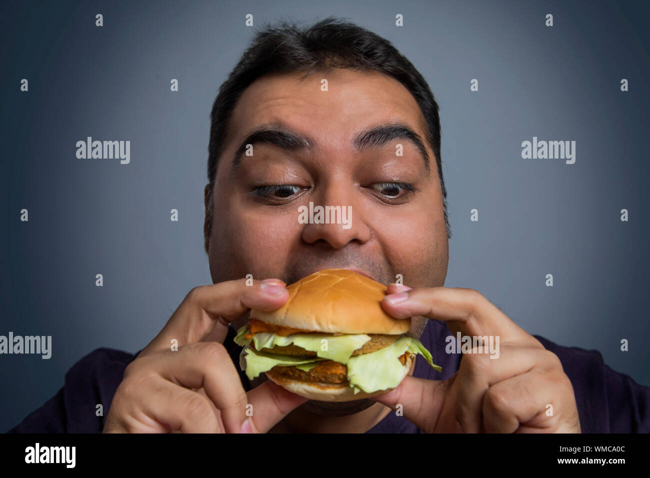 Fat man eating hi-res stock photography and images - Alamy
