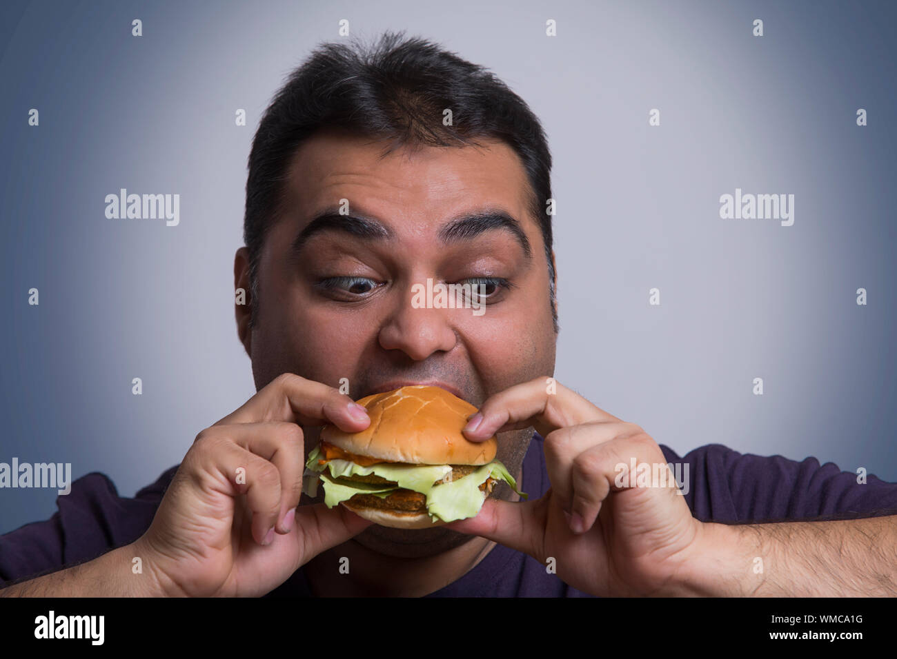 Fat man eating hi-res stock photography and images - Alamy