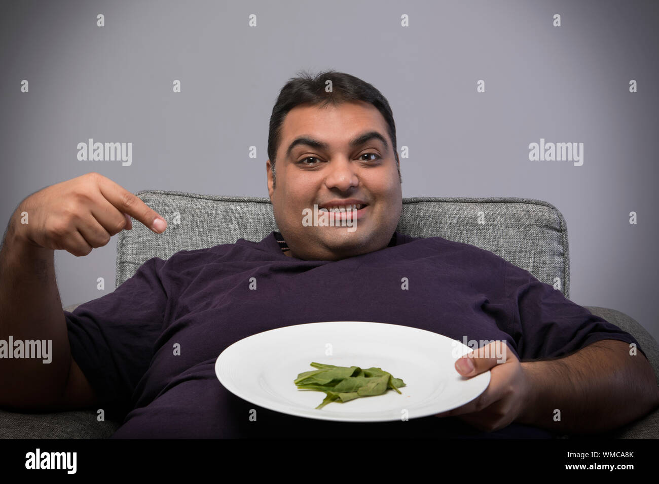 Overweight man sitting on chair hi-res stock photography and images - Alamy