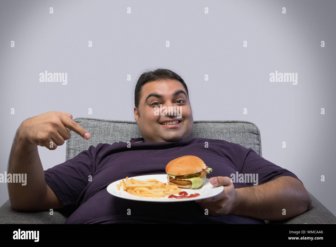 Fat man on chair hi-res stock photography and images - Alamy