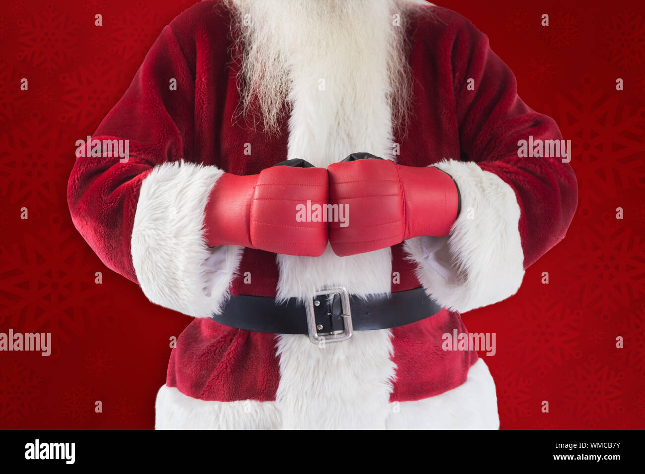 Santa Claus wears boxing gloves against red background Stock Photo - Alamy