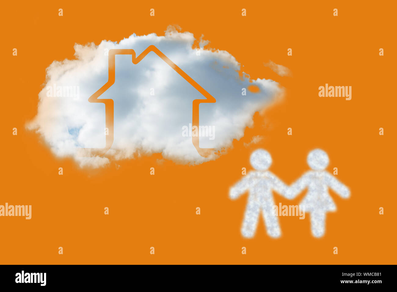Cloud in shape of couple against orange vignette Stock Photo - Alamy