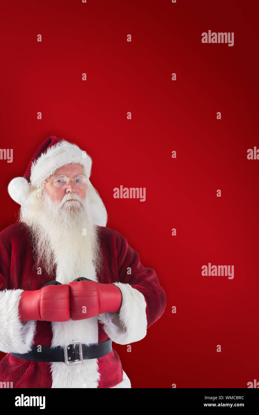 Santa Claus wears boxing gloves against red background Stock Photo - Alamy