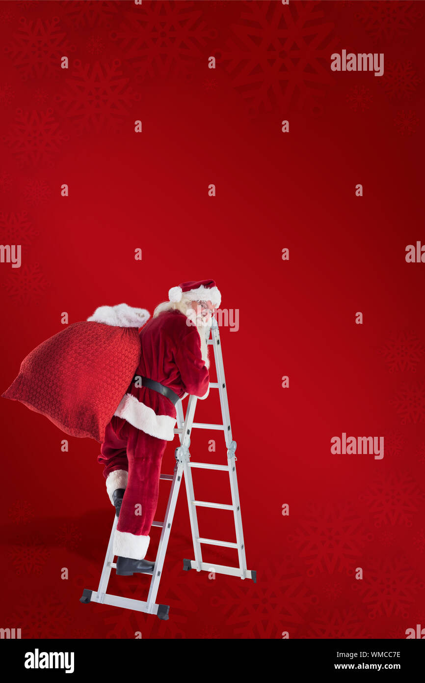 Santa steps up a ladder against red background Stock Photo - Alamy