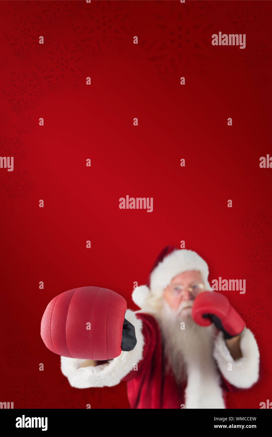 Santa Claus punches with his right against red background Stock Photo ...