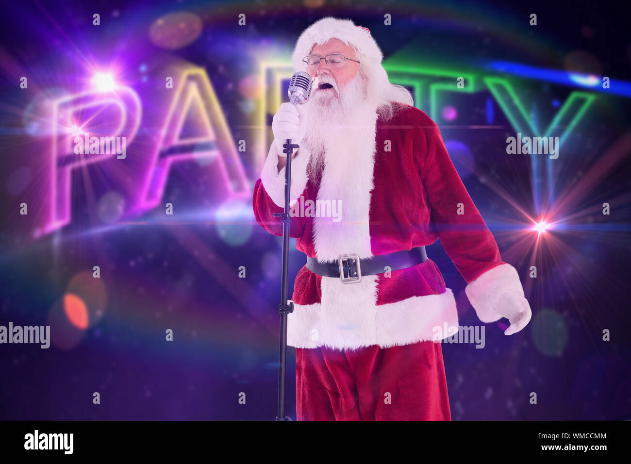 Santa sings like a Superstar against digitally generated colourful ...