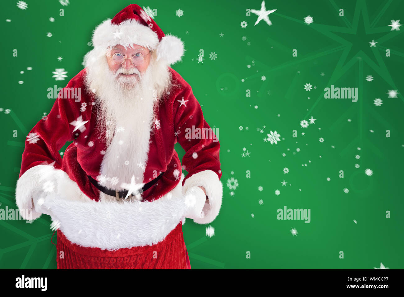 Santa open his red bag against green snowflake background Stock Photo ...