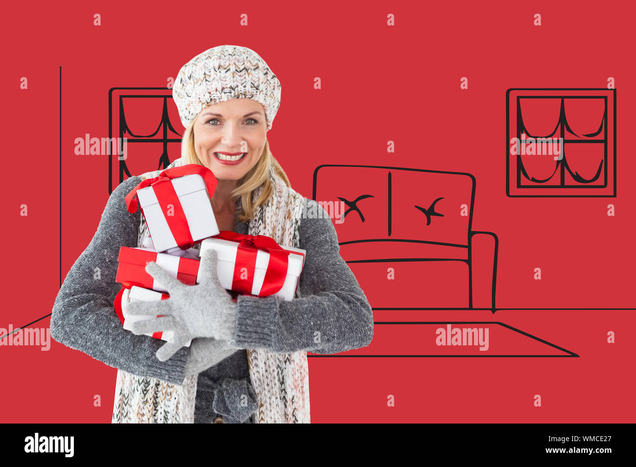Happy blonde with gifts against red vignette Stock Photo - Alamy