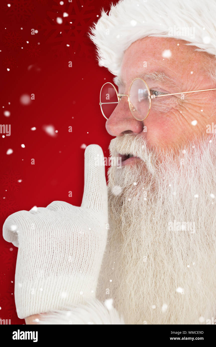 Santa claus making quiet sign against red snowflake background Stock ...