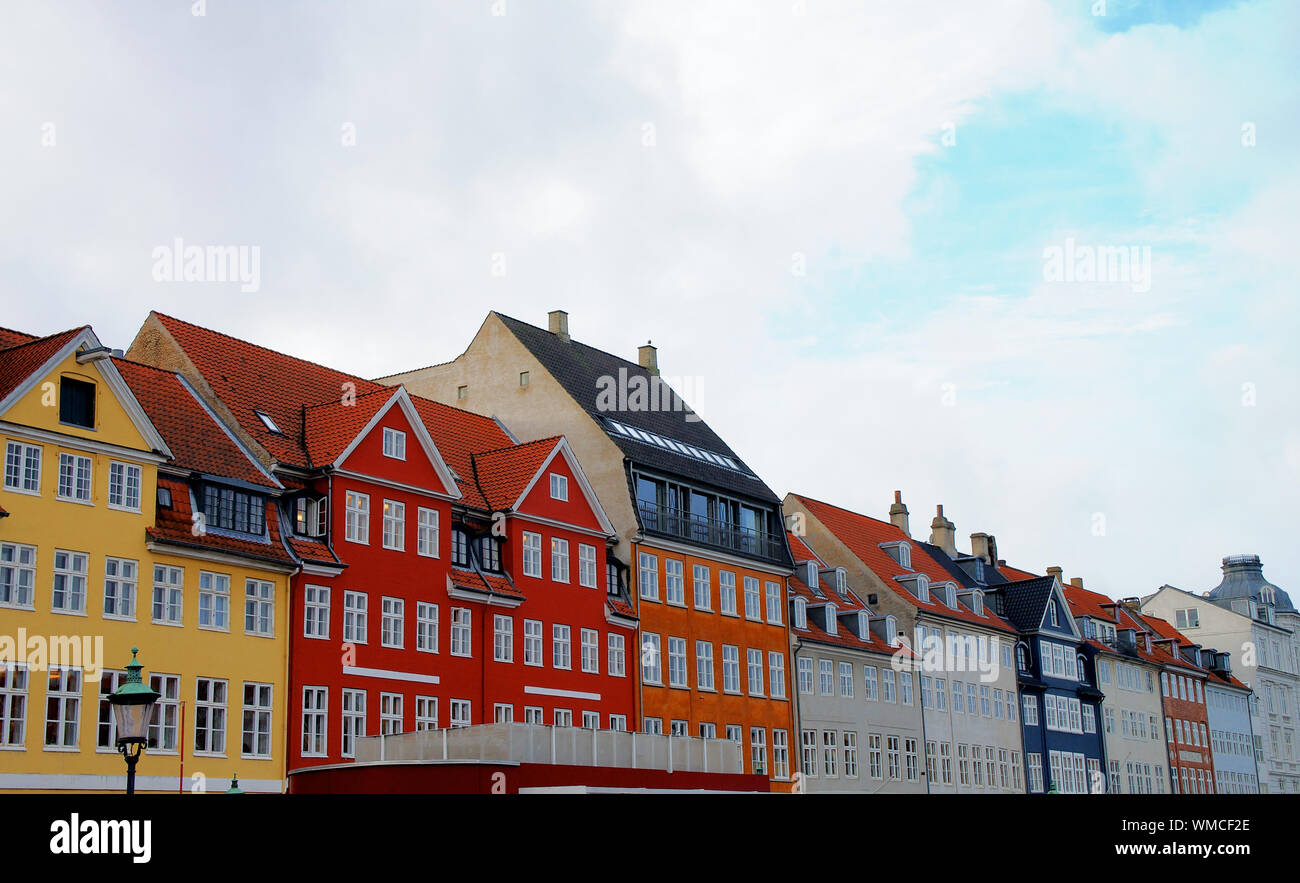 Famous Houses in Nyhavn Copenhagen, Denmark. In Red House in Foreground ...