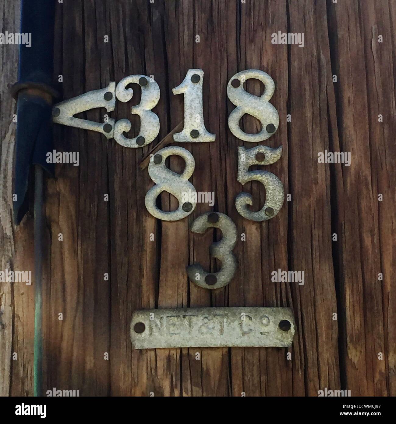 Metal numbers on telephone pole hi-res stock photography and images - Alamy