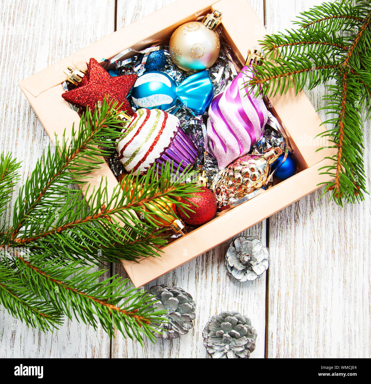christmas baubles in the box with green pine tree Stock Photo - Alamy