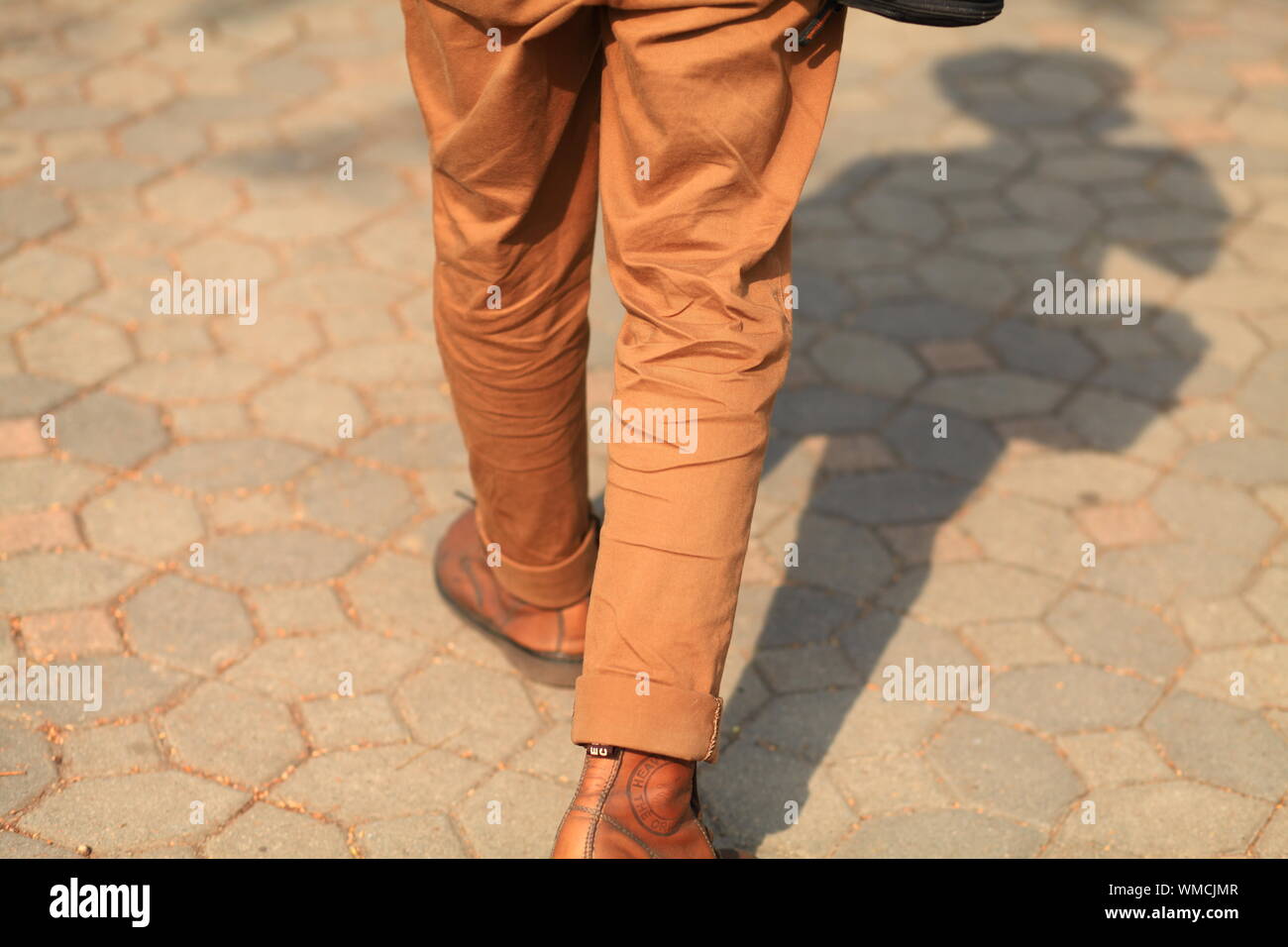 Man walking on paving hi-res stock photography and images - Alamy