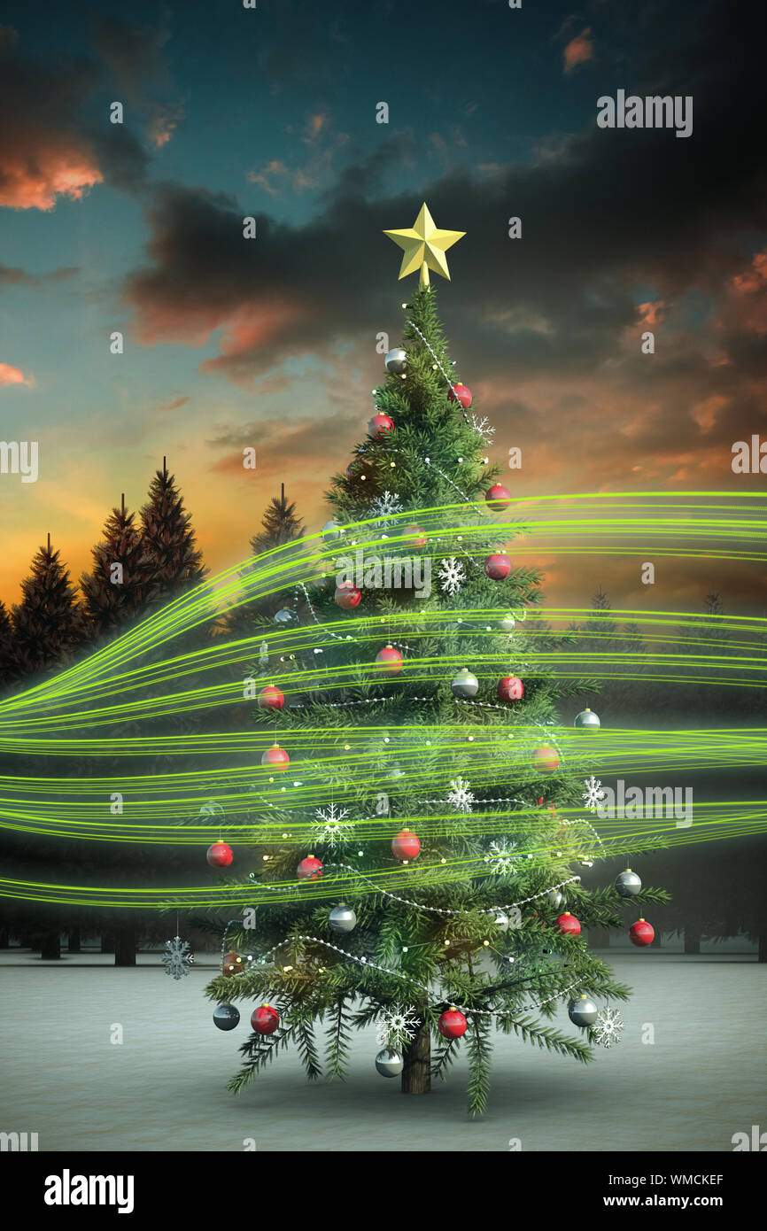 Composite image of christmas tree with falling snow Stock Photo - Alamy
