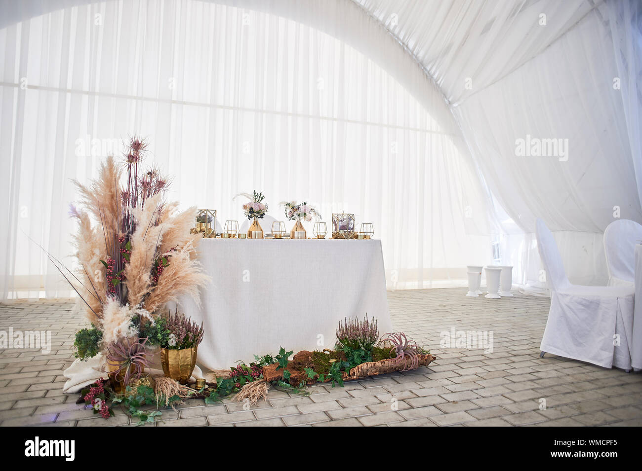 Wedding decoration in boho style.Light colors, in the tent.Wedding ...