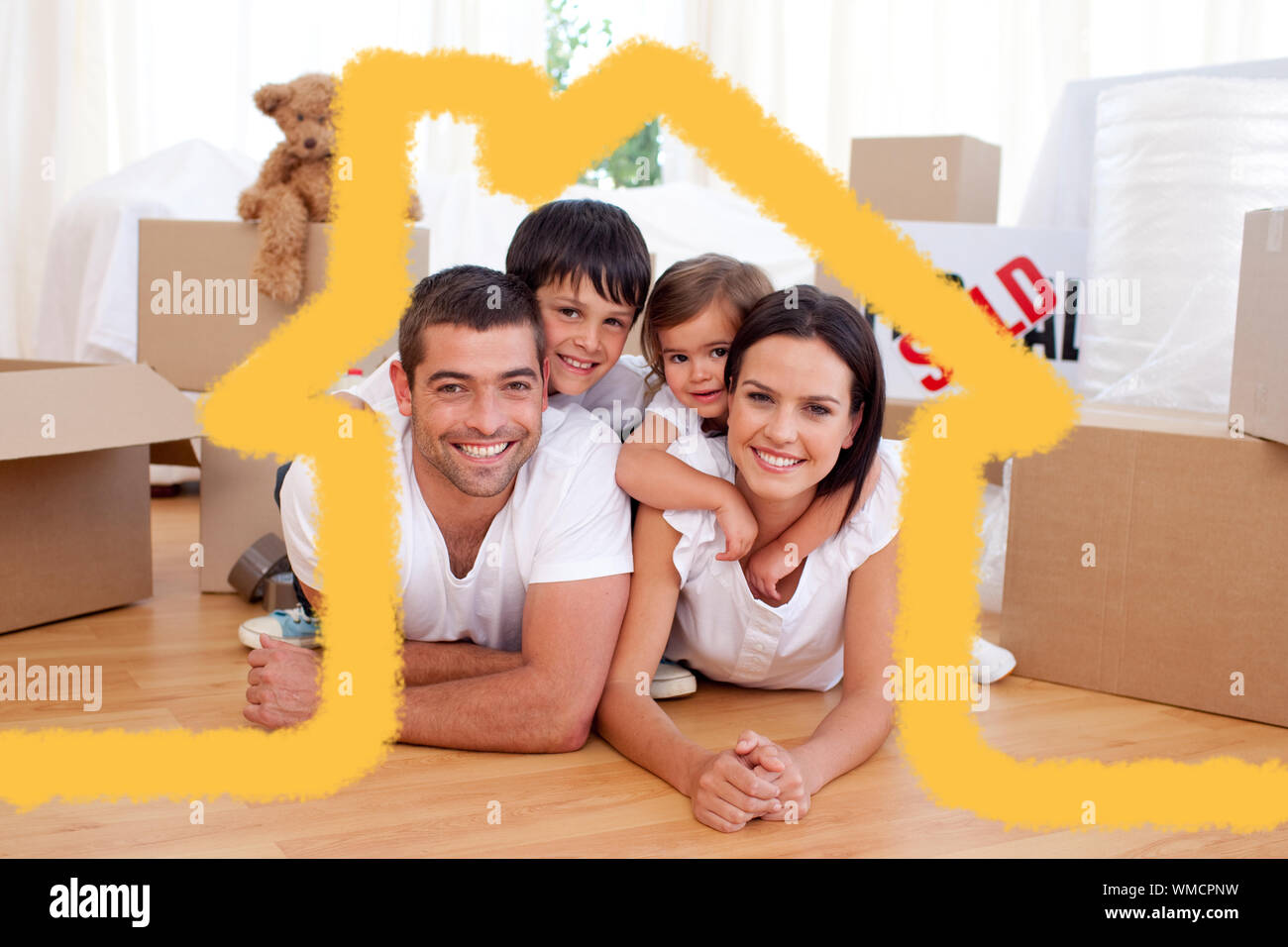 Happy family after buying new house against house outline Stock Photo ...