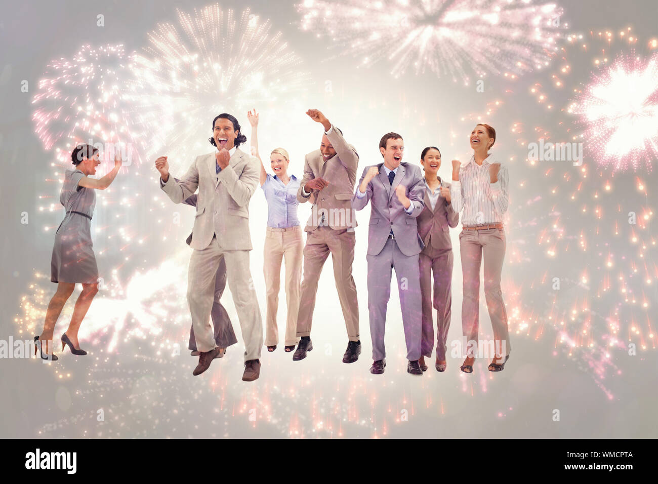 Very happy business people jumping and clenching their fists against ...