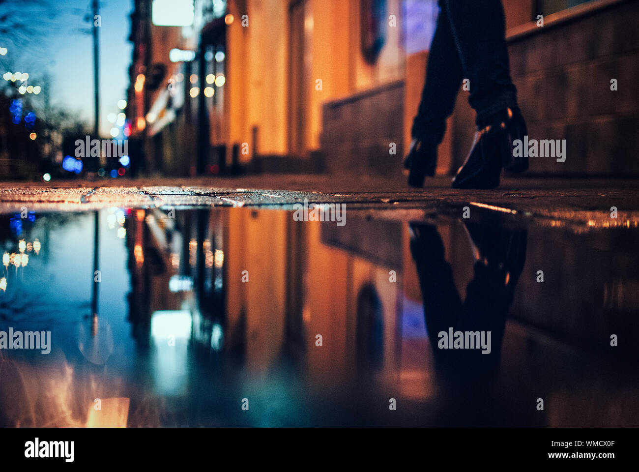 Reflection woman puddle city hi-res stock photography and images - Alamy