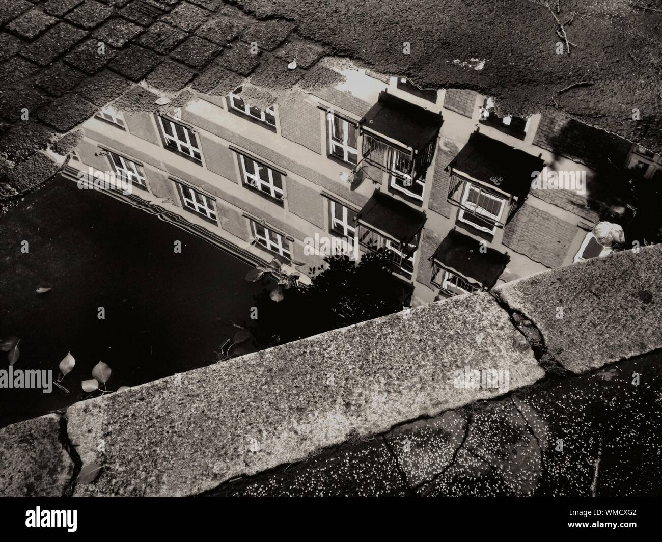 Puddle paving pavement hi-res stock photography and images - Alamy