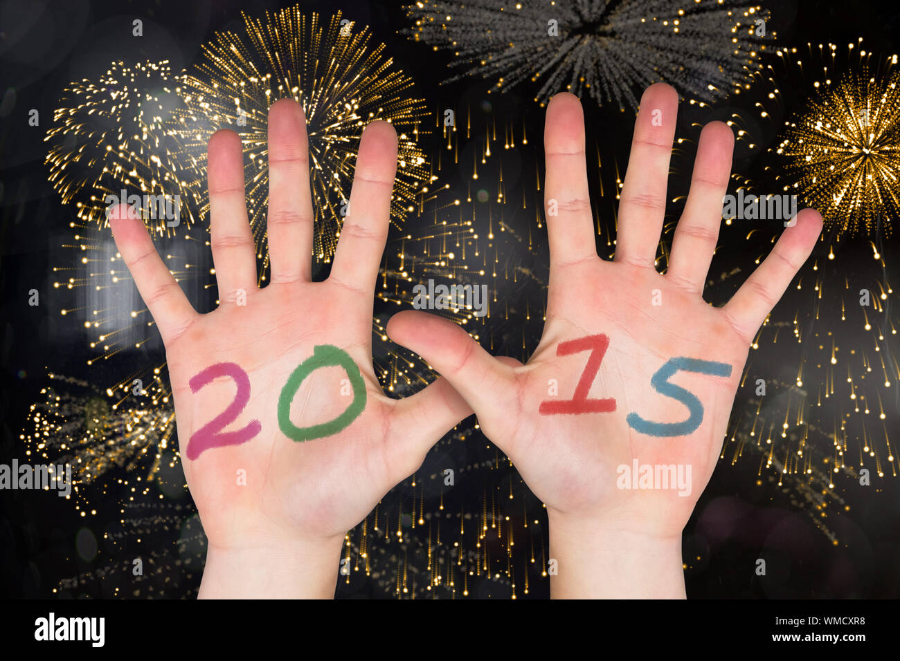 Hands against colourful fireworks exploding on black background Stock ...