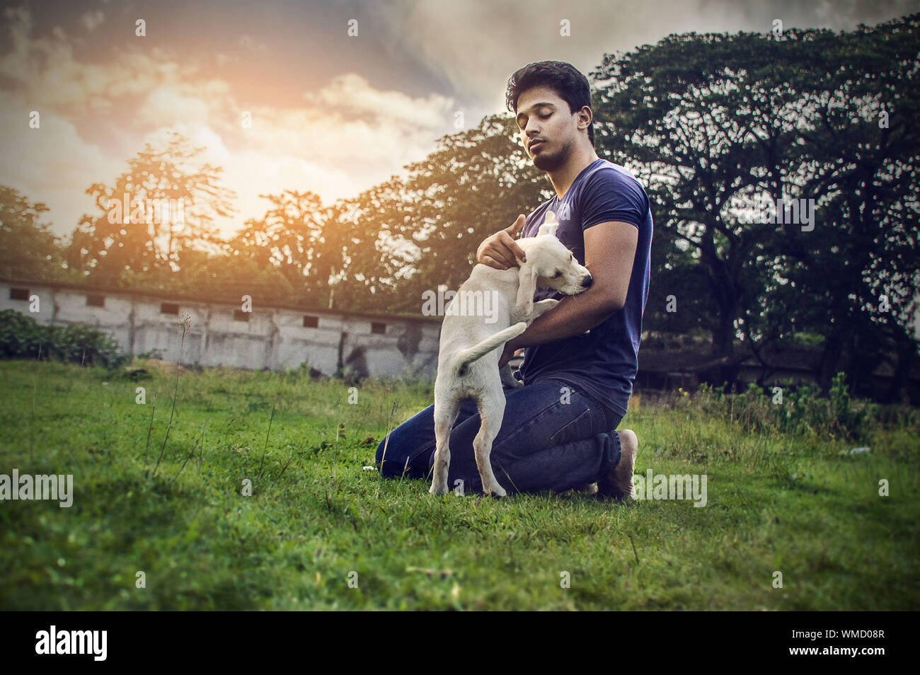 Man kneeling side hi-res stock photography and images - Alamy